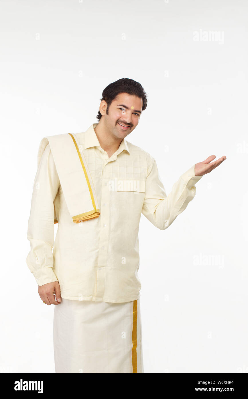 South Indian man smiling and gesturing Stock Photo - Alamy