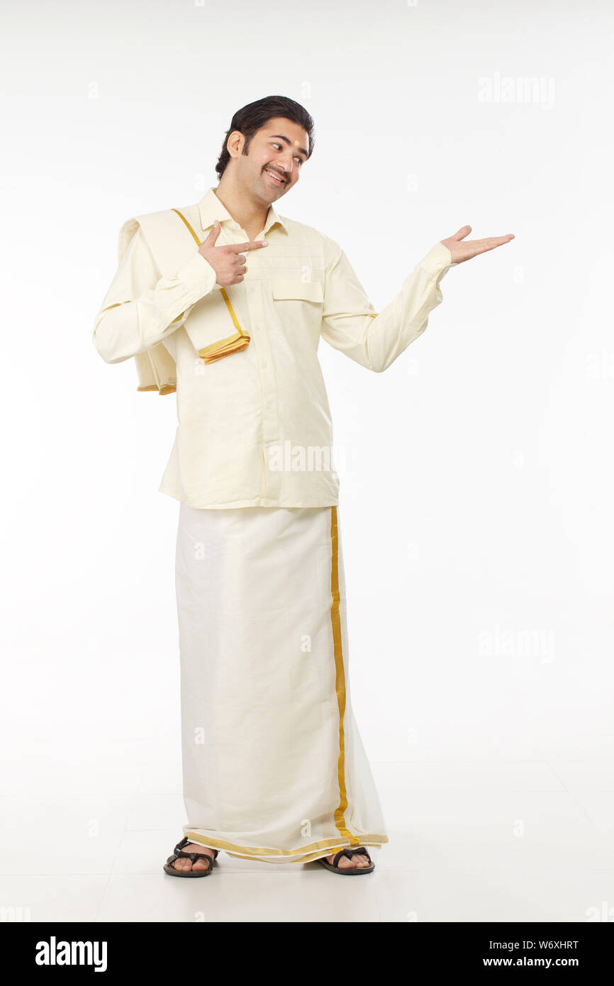 South Indian man smiling and gesturing Stock Photo - Alamy