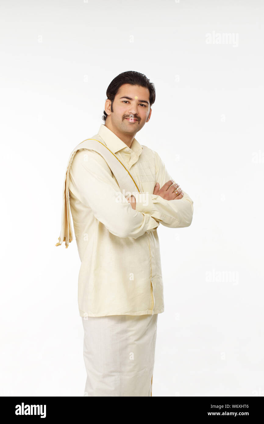South indian man standing arms hi-res stock photography and images - Alamy