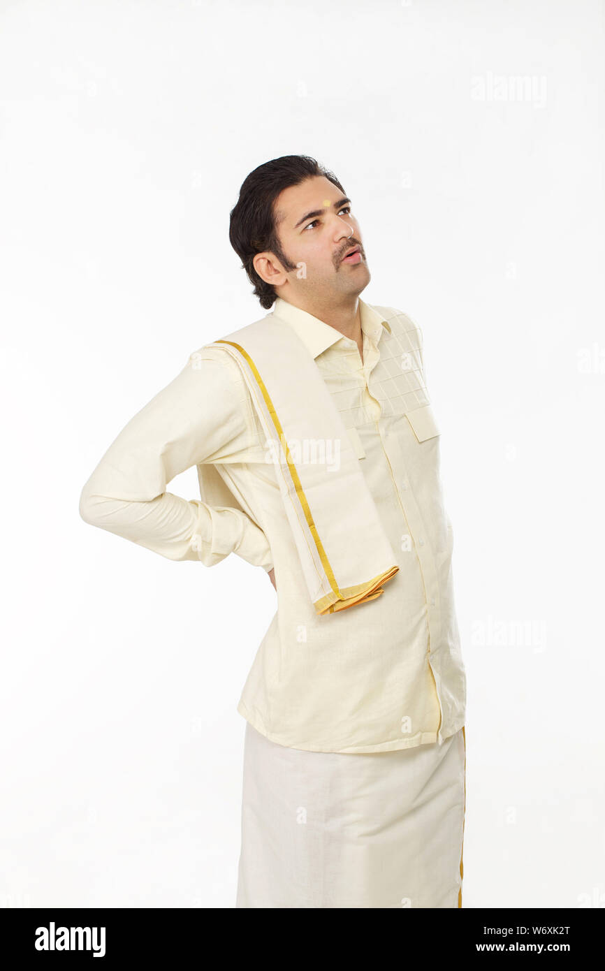 South Indian man suffering from back pain Stock Photo - Alamy