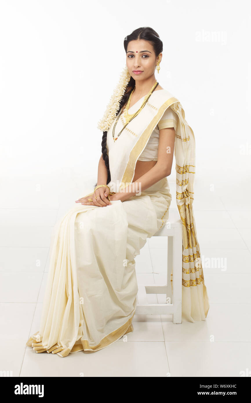 Side view indian girl sitting hi-res stock photography and images - Alamy