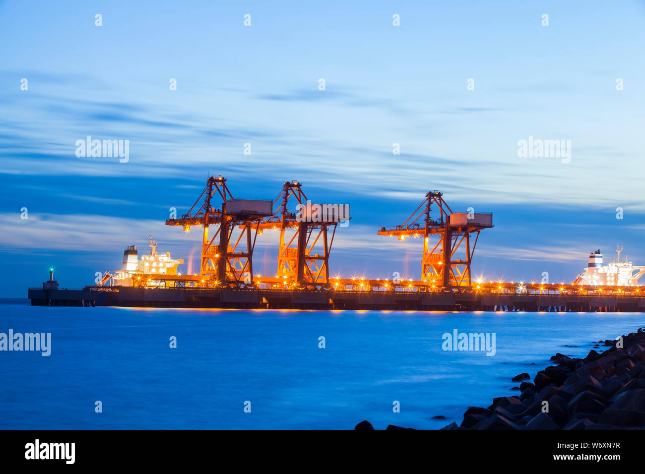 Container terminals and Bridges, cargo terminals in the evening Stock Photo - Alamy