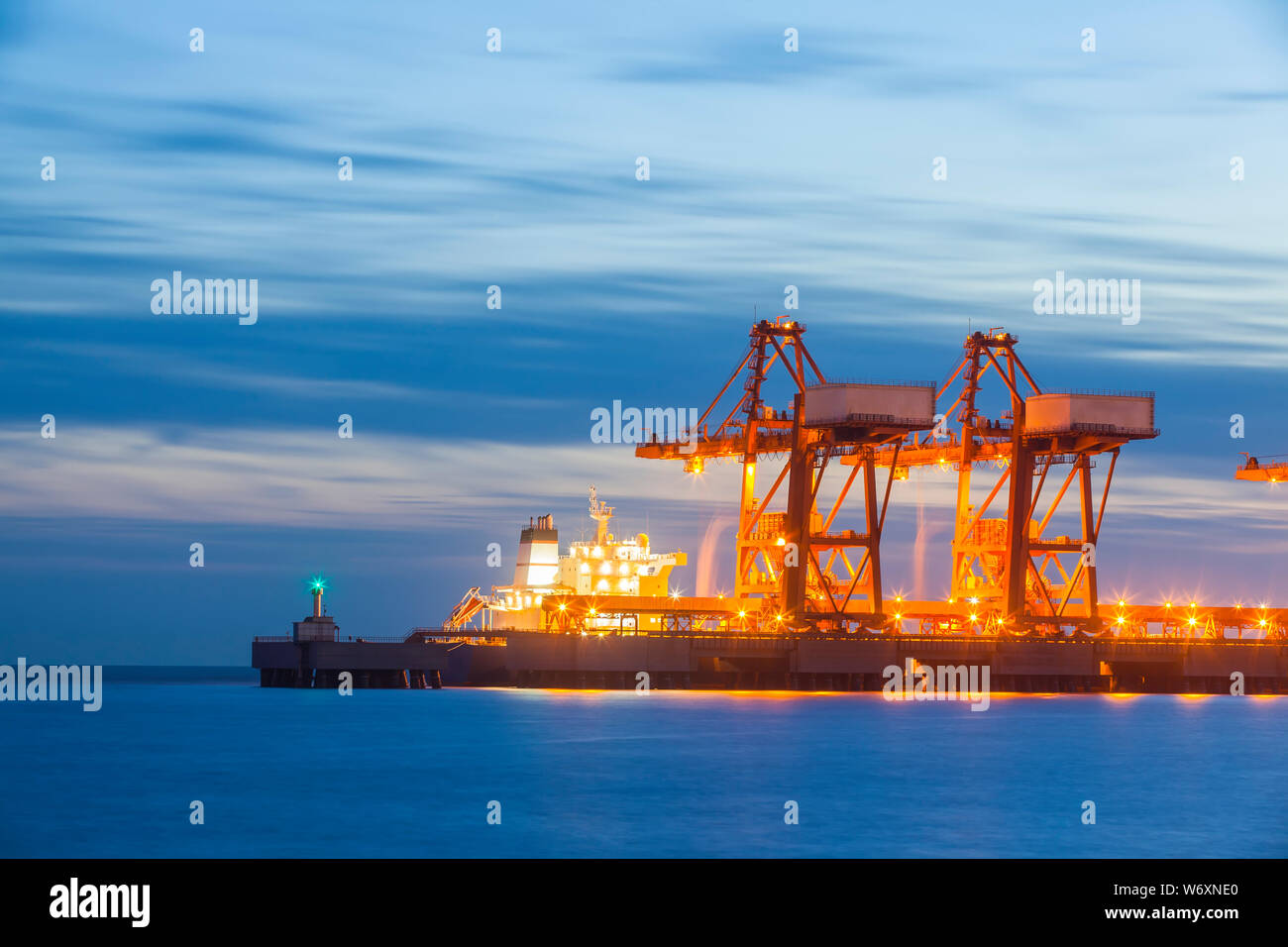 Container terminals and Bridges, cargo terminals in the evening Stock Photo - Alamy