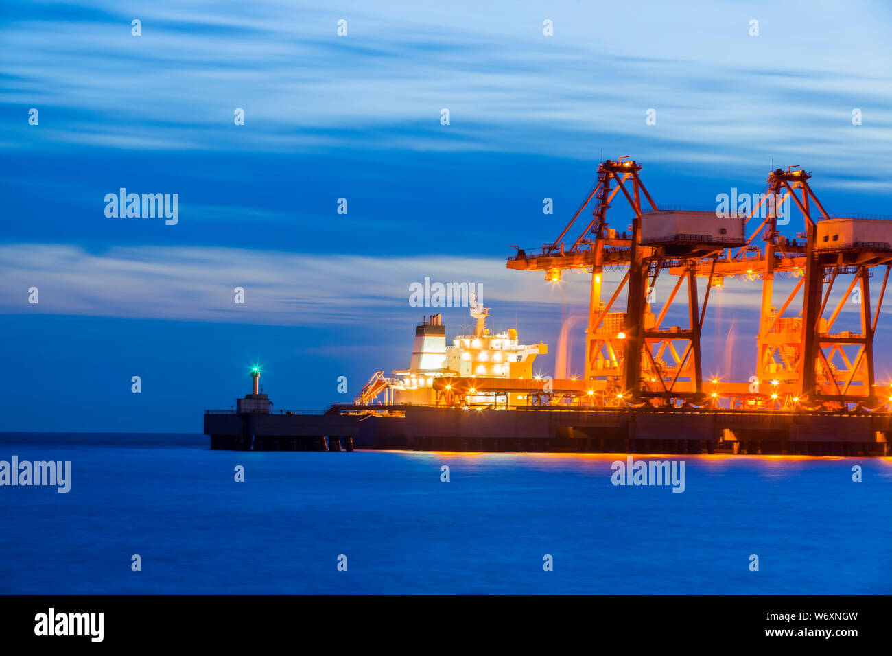 Container terminals and Bridges, cargo terminals in the evening Stock Photo - Alamy