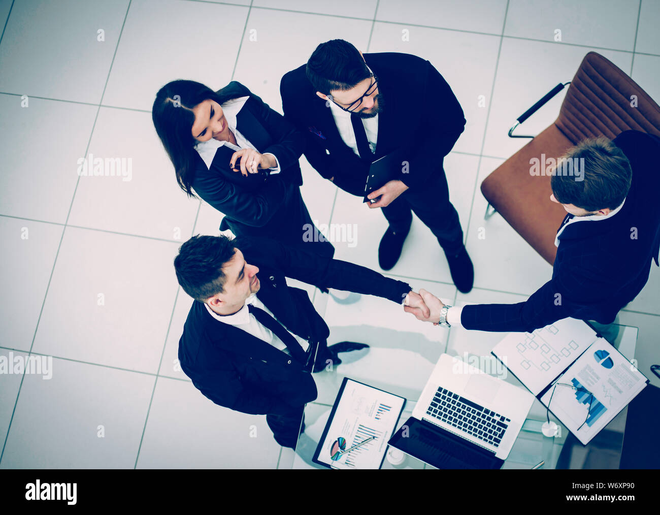 top view - reliable handshake business partners after the discussion of ...