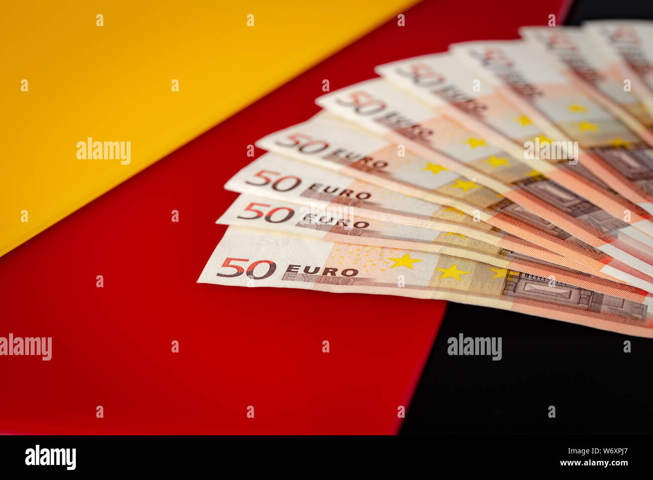 A German flag with euro banknotes Stock Photo - Alamy