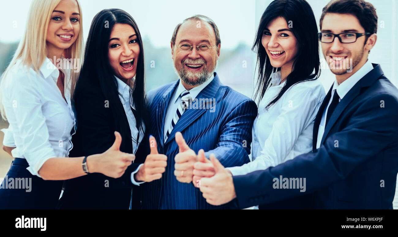 successful friendly business team on office background all showing ...