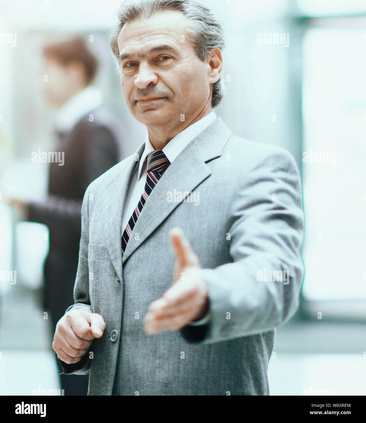 Welcoming business man ready to handshake with hand extended Stock ...