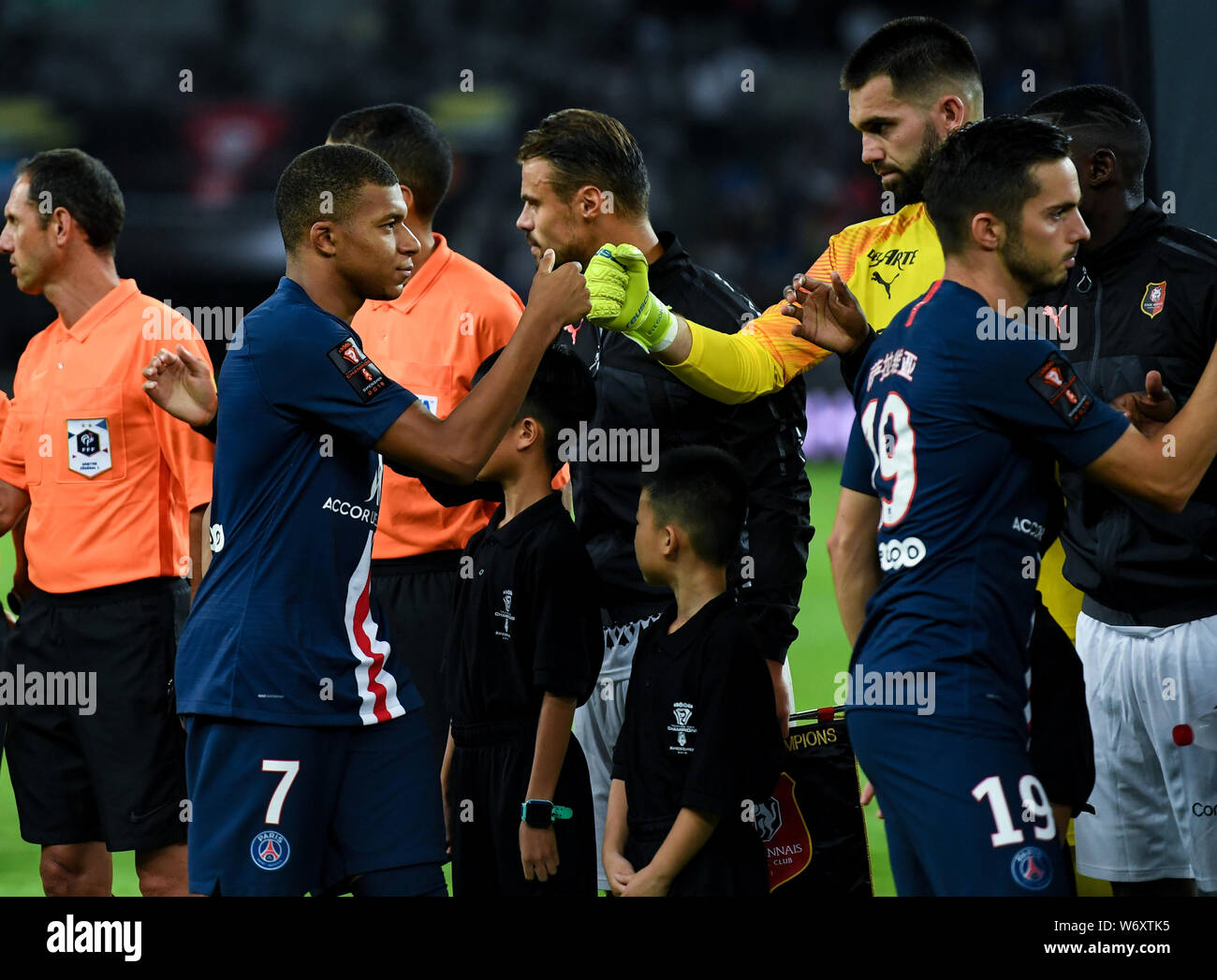 Shenzhen. 3rd Aug, 2019. Kylian Mbappe (L) reacts with Tomas Koubek of ...