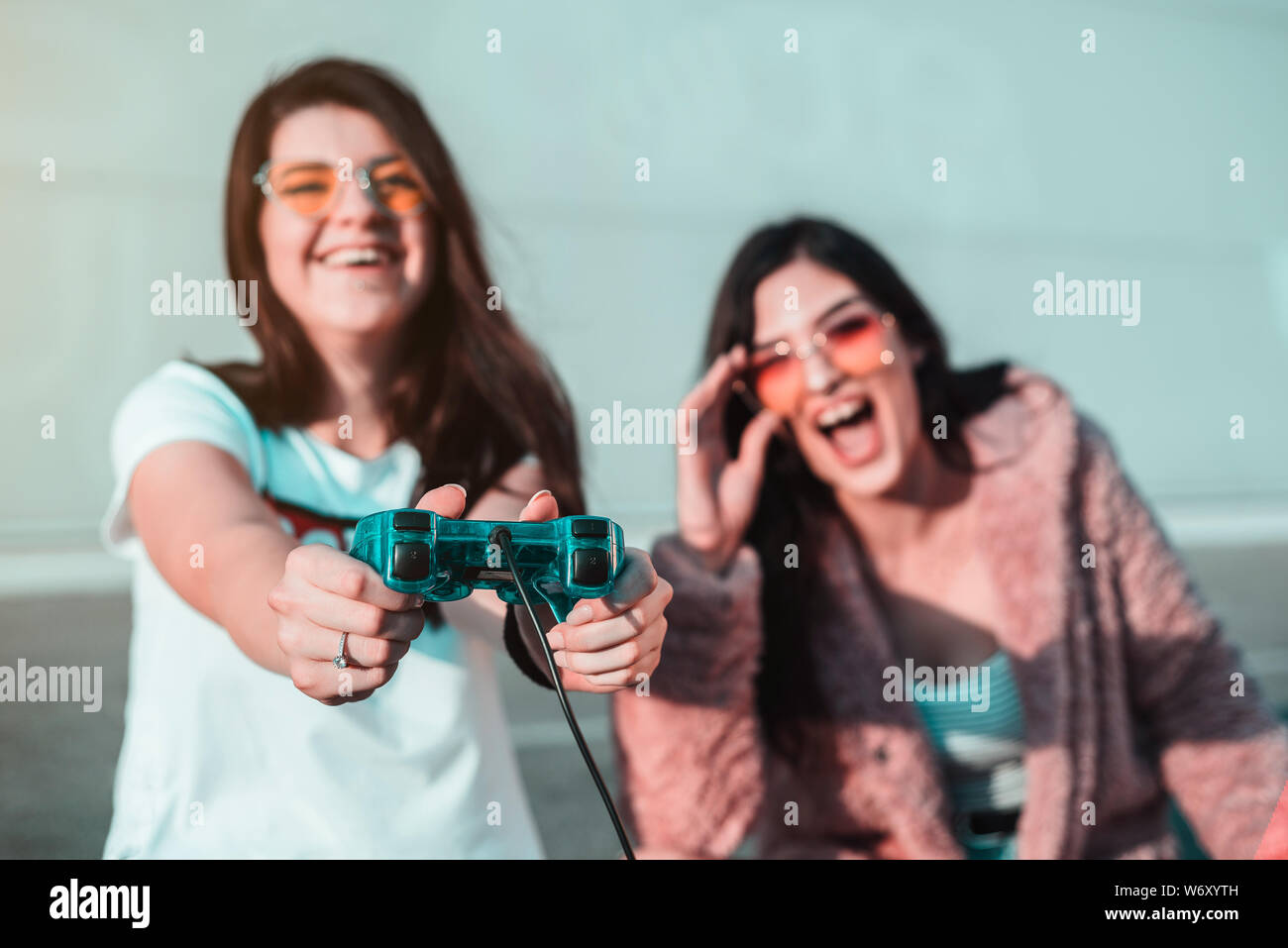 Two young friends playing video hi-res stock photography and images - Alamy