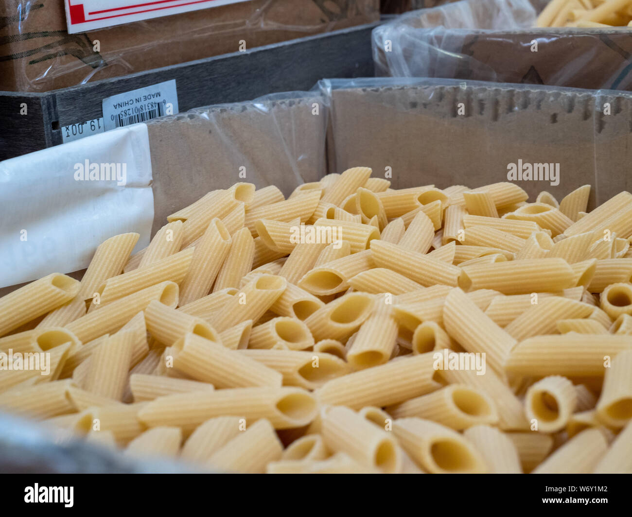 Mound of dried penne pasta in storage ready to cook Stock Photo - Alamy