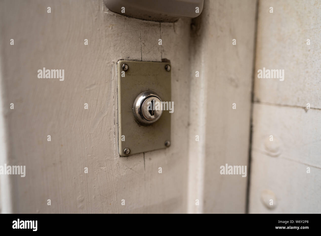 Key lock hole drilled into wooden door underneath door handle Stock ...