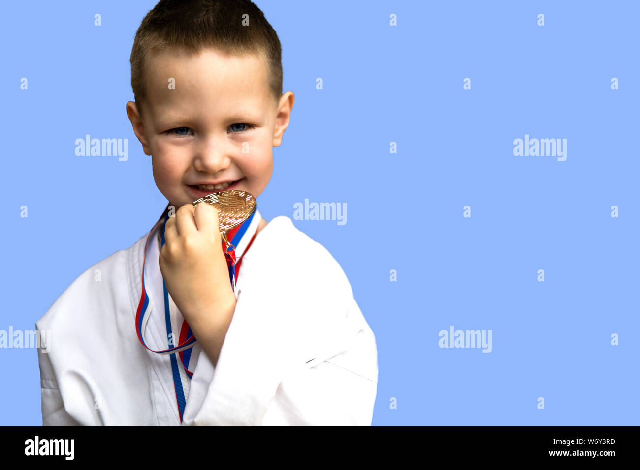 Sport success and win concept - smiling athlete champion child boy hand ... Sport success and win concept - smiling athlete champion child boy hand ...