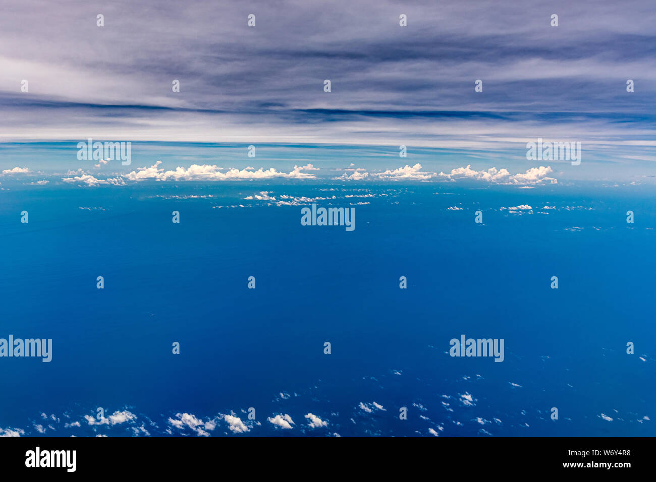 Skyline View above the Clouds from airplane Stock Photo - Alamy