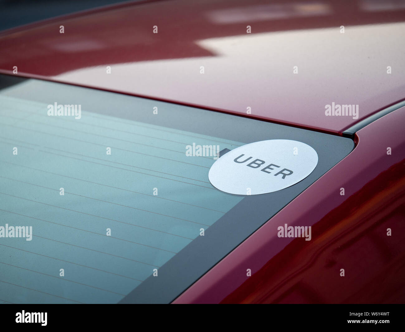 Car with Uber ride share decal on rear window of car Stock Photo - Alamy