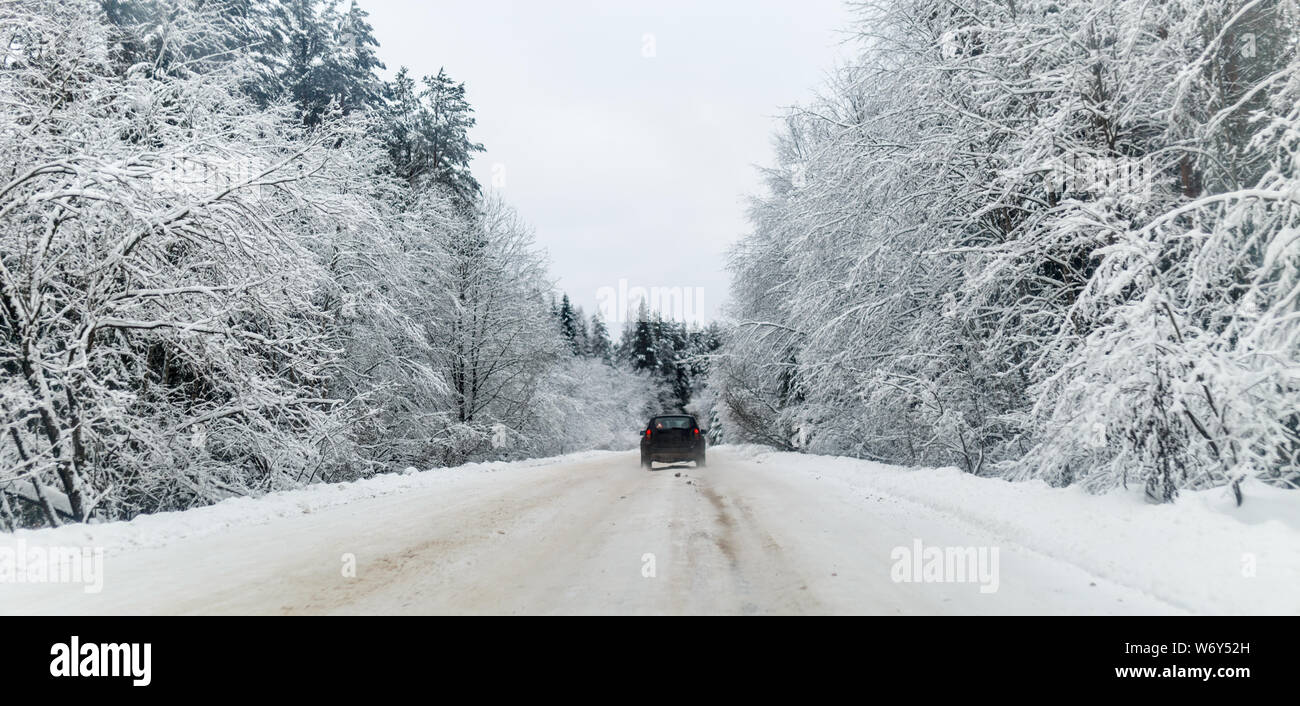Photo of winter road with trees in snow by day Stock Photo - Alamy