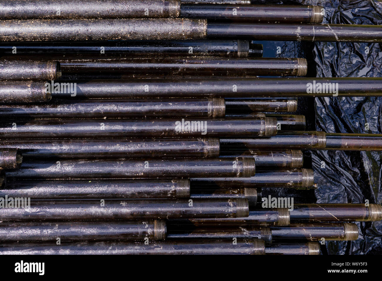 Oil Drill pipe. Rusty drill pipes were drilled in the well section ...