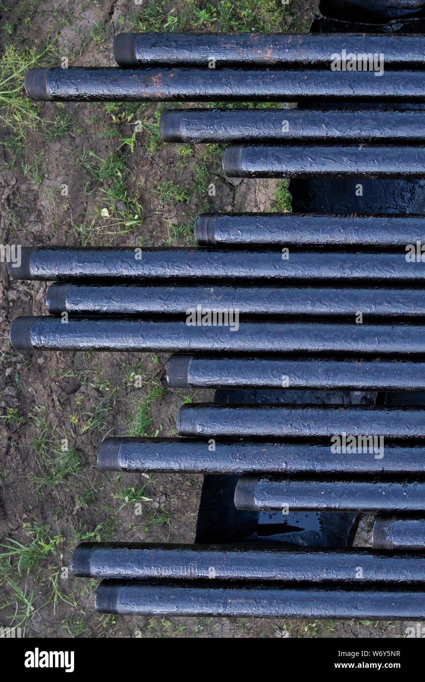 Oil Drill pipe. Rusty drill pipes were drilled in the well section ...
