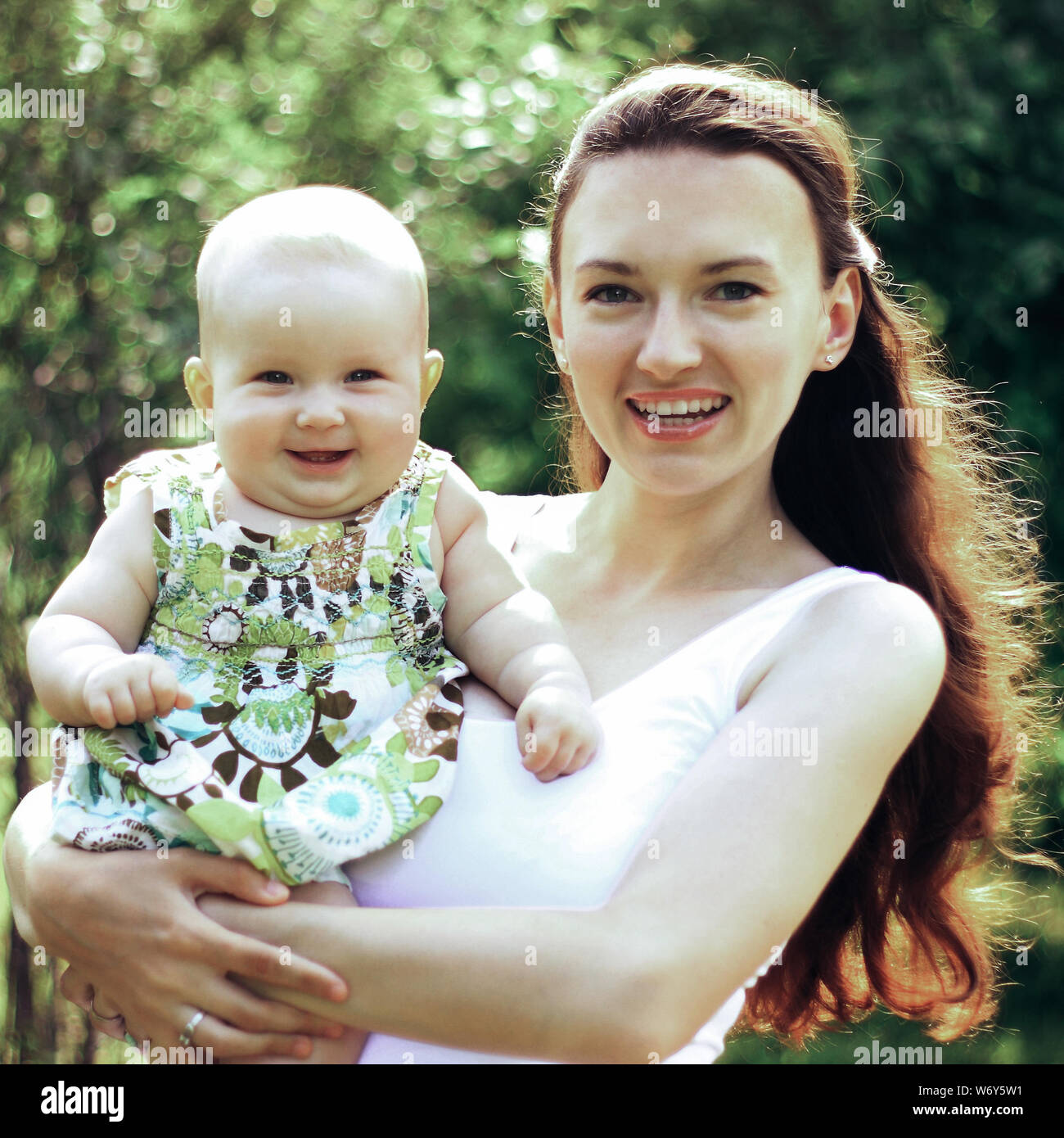 Beautiful Mother And Baby outdoors. Nature. Beauty Mum and her Child ...