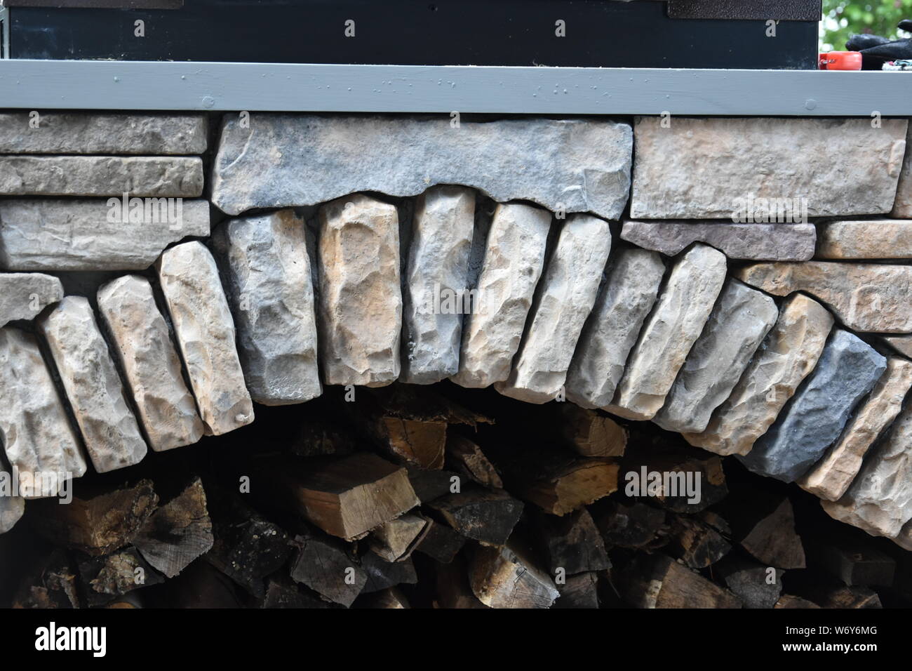 An outdoor kitchen and pizza oven with ornate stonework Stock Photo - Alamy