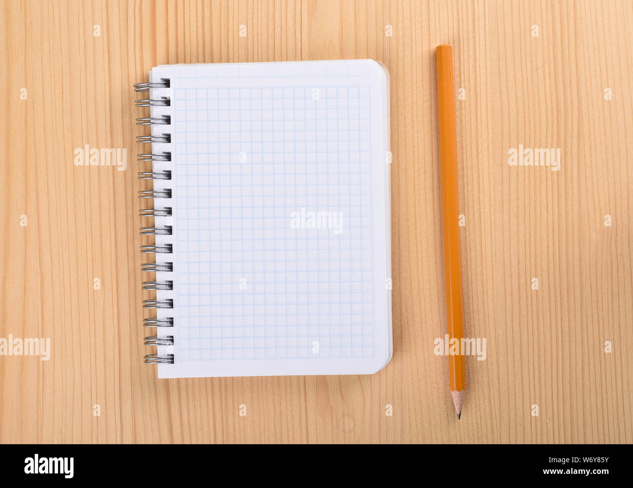 Close up notepad. Squared paper notebook on wooden table top view ...