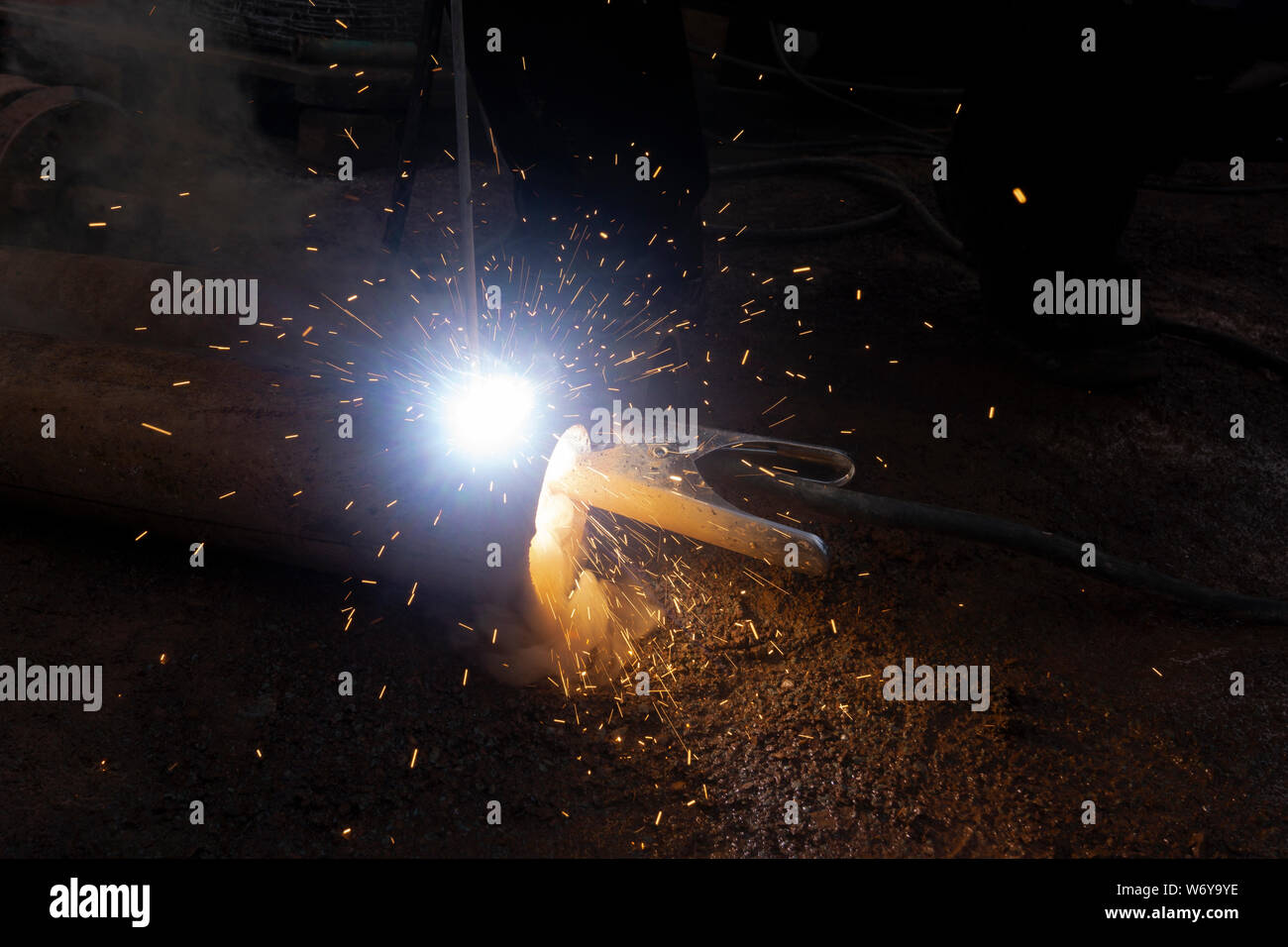 Operator welding steel construction. Industrial worker during welding ...