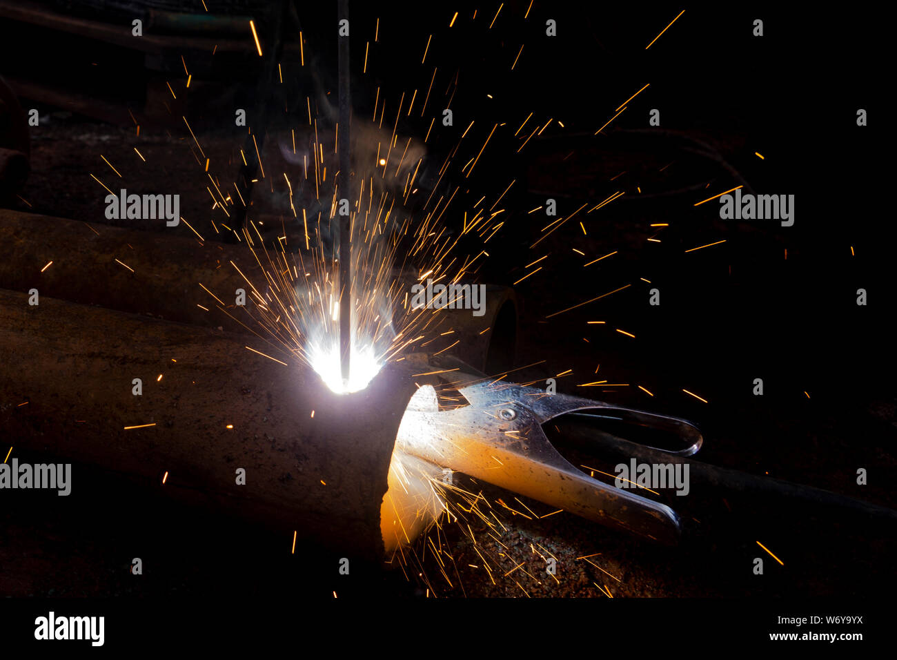Operator welding steel construction. Industrial worker during welding ...