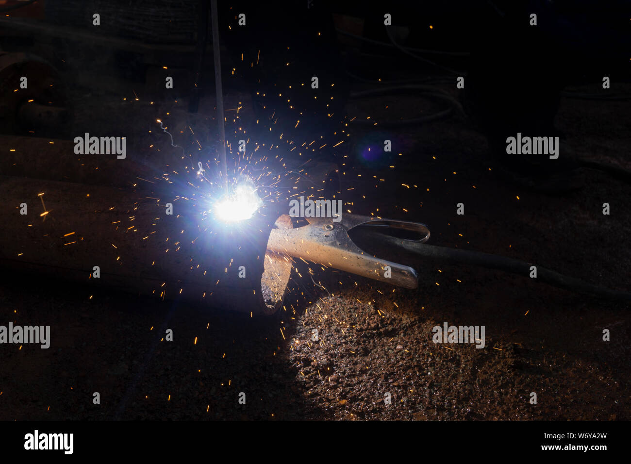 Operator welding steel construction. Industrial worker during welding ...