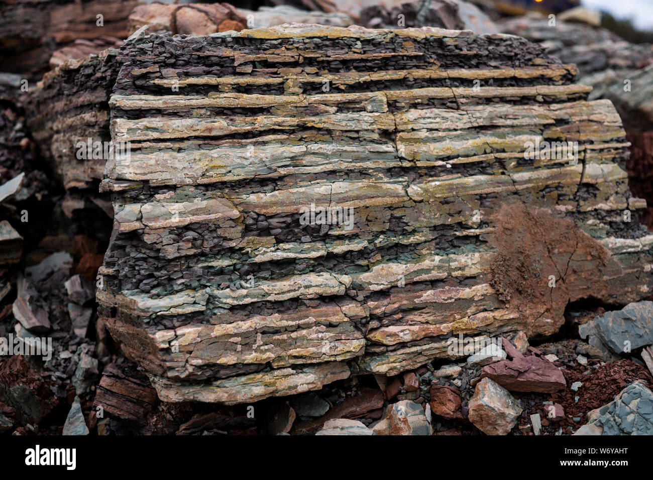 Soil cut-sandstone, stones, clay, sand structure and layers. slice of ...