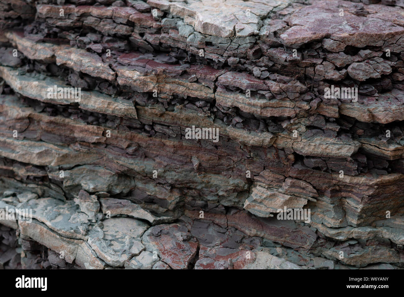 Soil cut-sandstone, stones, clay, sand structure and layers. slice of ...