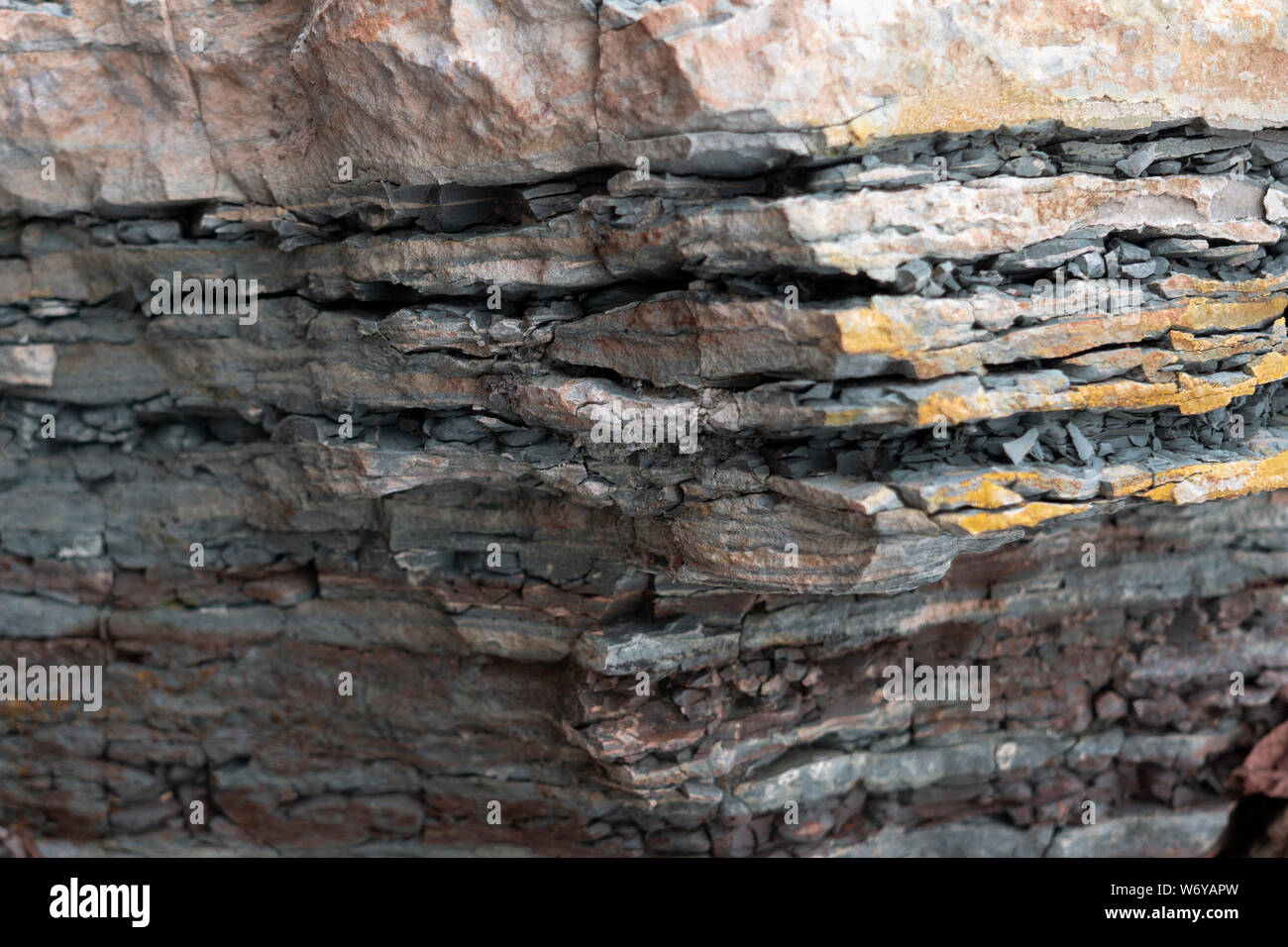 Soil cut-sandstone, stones, clay, sand structure and layers. slice of ...