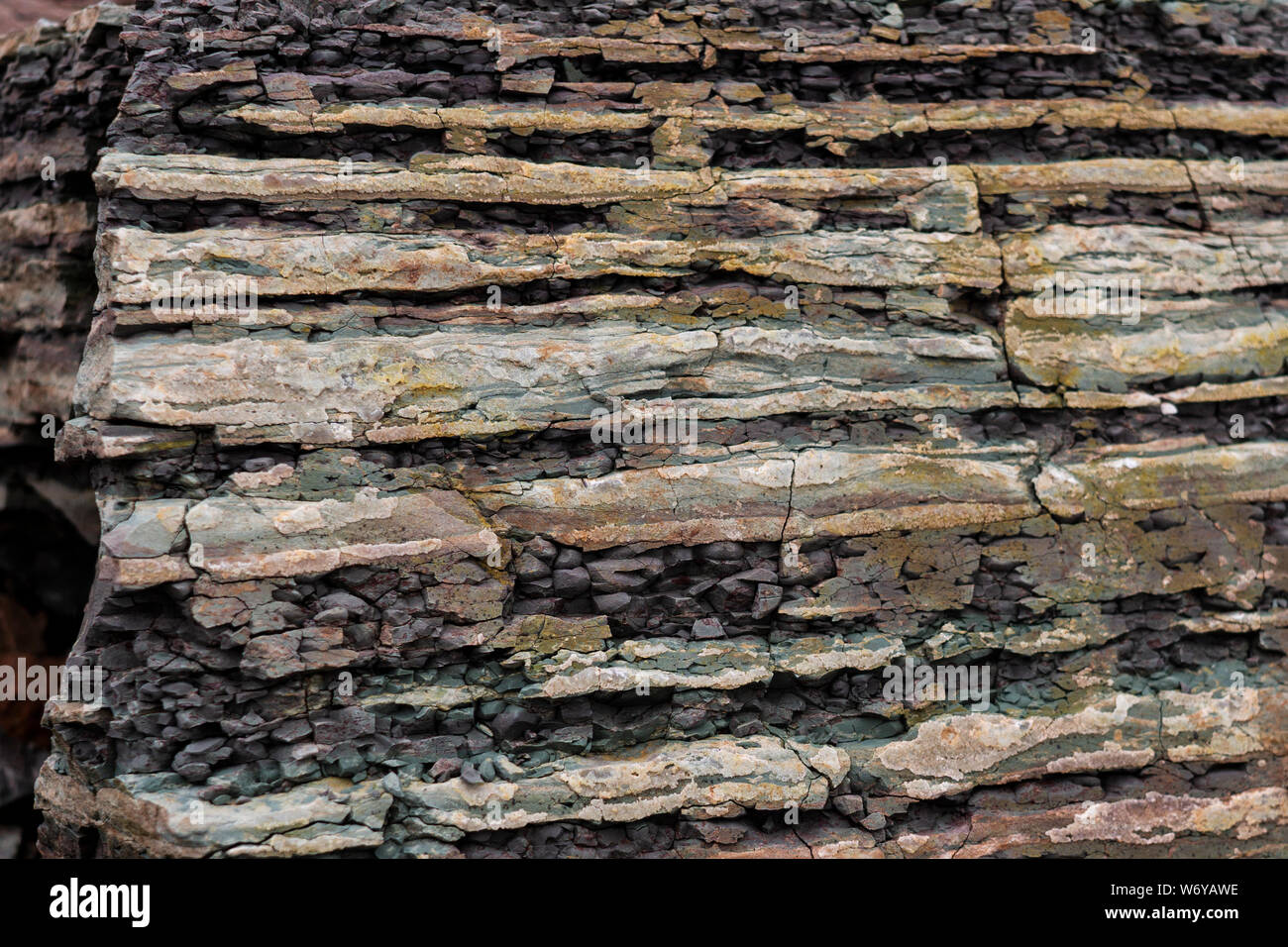 Soil cut-sandstone, stones, clay, sand structure and layers. slice of ...