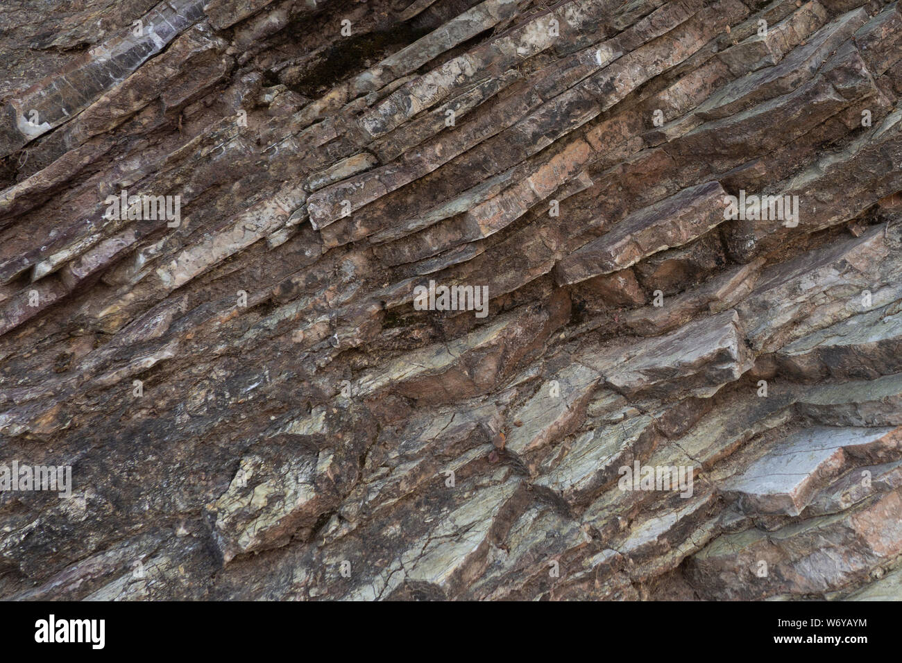 Soil cut-sandstone, stones, clay, sand structure and layers. slice of ...