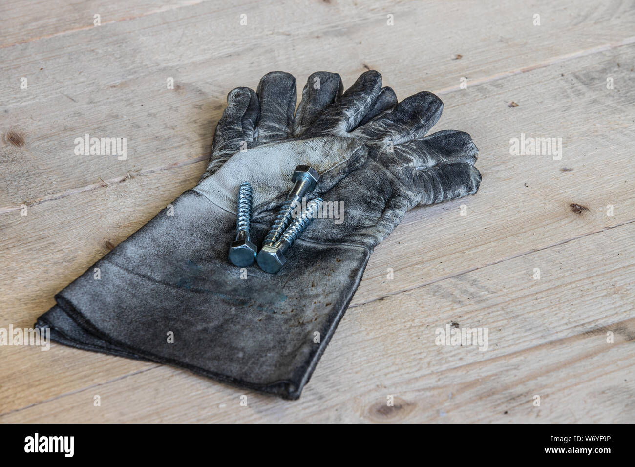 Dirty gloves hi-res stock photography and images - Alamy