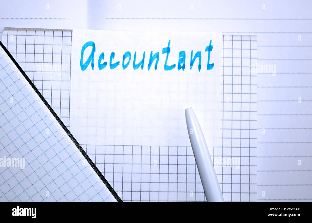 The word ACCOUNTANT is written by hand on the paper. Concept of ...