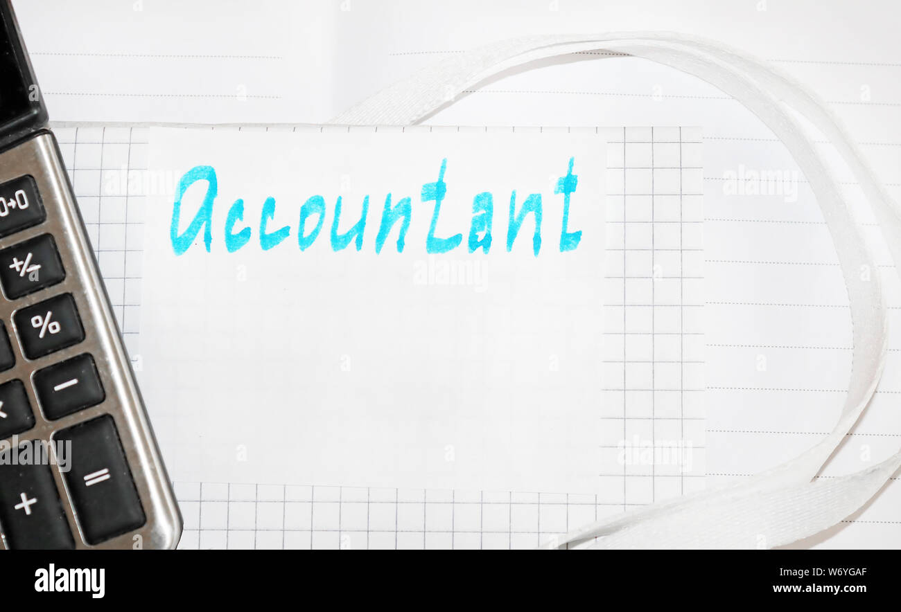 The word ACCOUNTANT is written by hand on the paper. Concept of ...