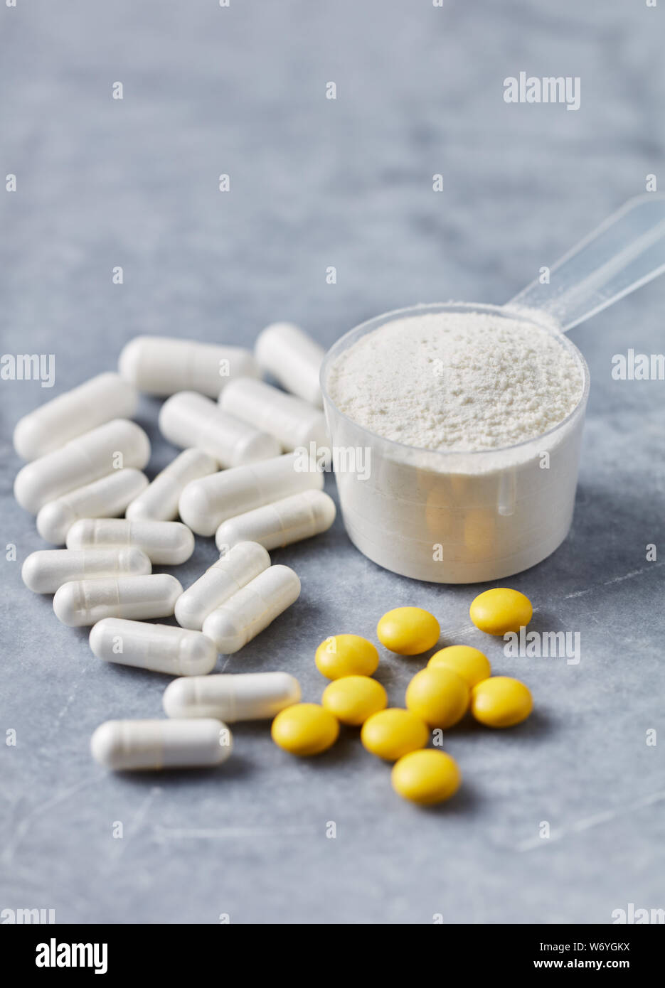 Collagen powder, Proline capsules and Vitamin C tablets. Supplements to ...