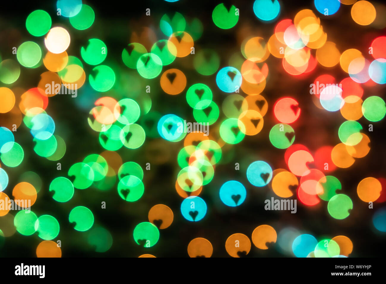 Heart shape multi colour blur bokeh abstract background Stock Photo - Alamy