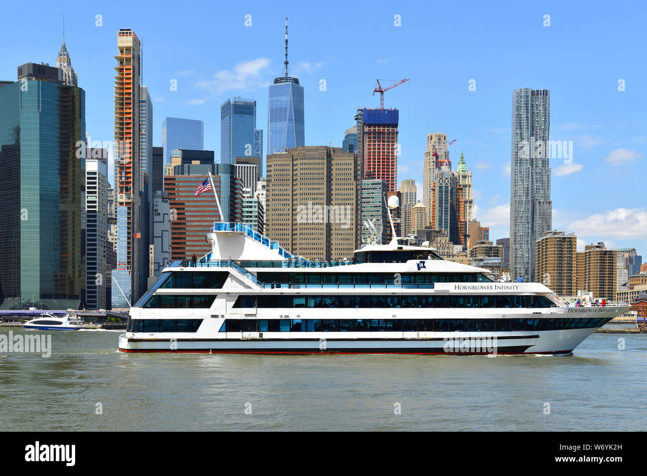 Hornblower Infinity Yacht on background of Manhattan's famous ...