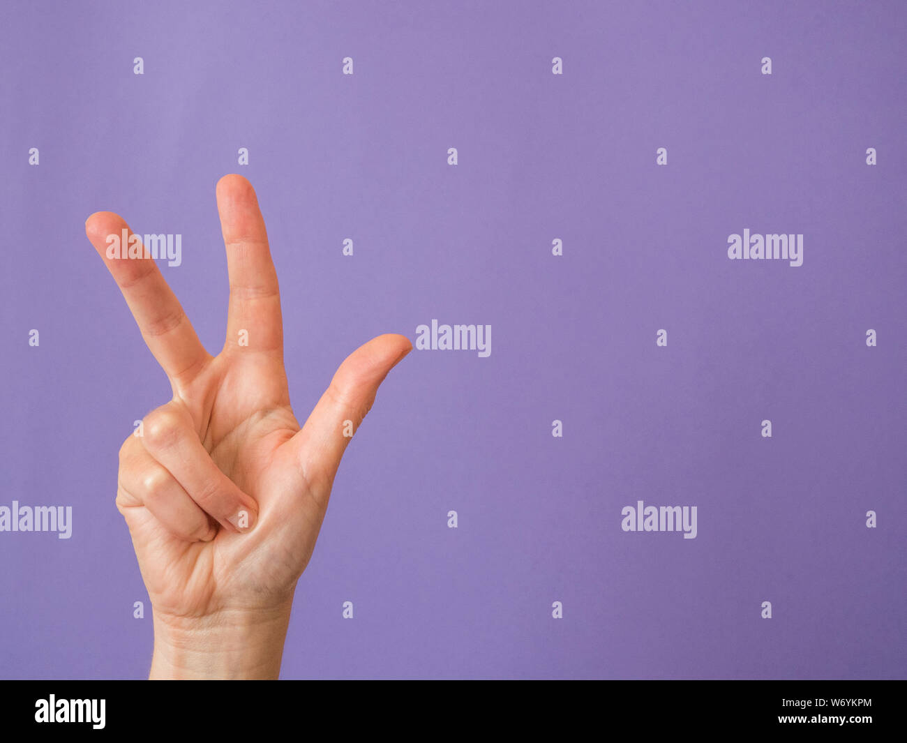 Woman hand showing three fingers hi-res stock photography and images ...