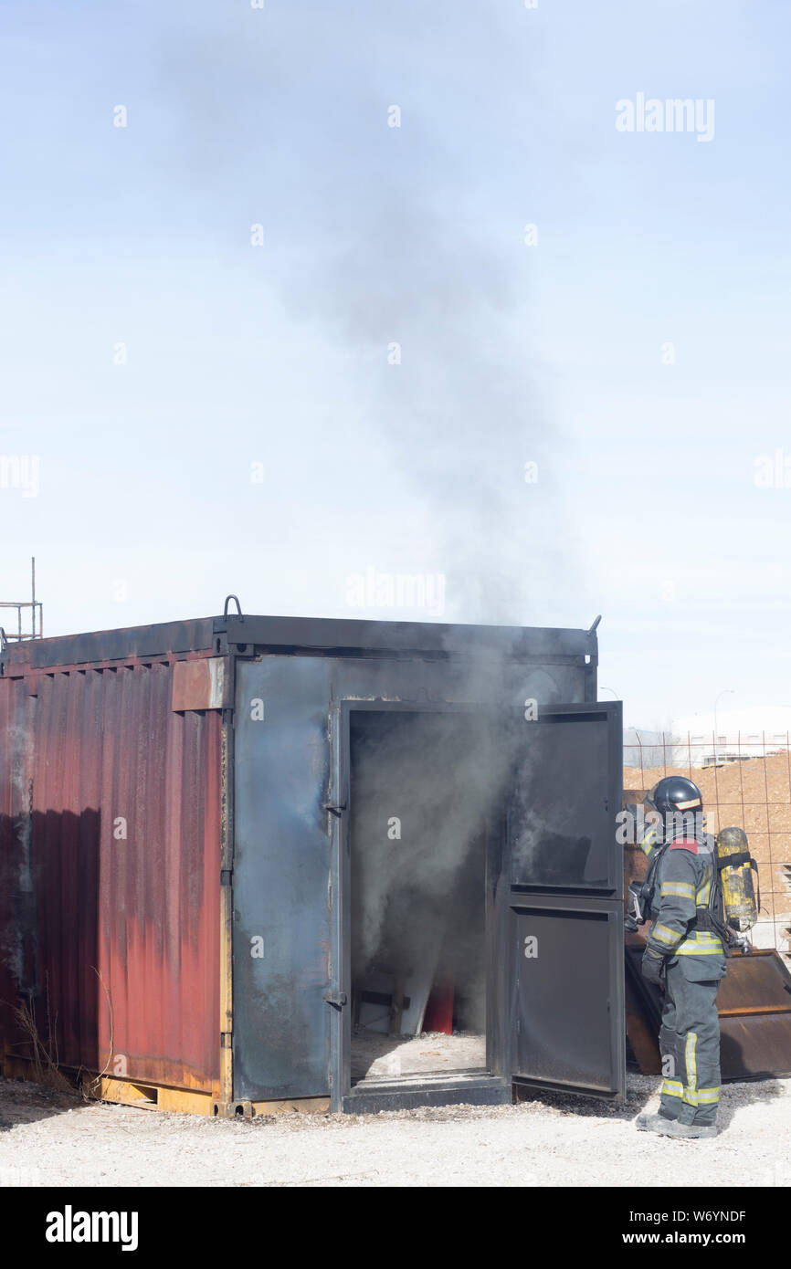 Firefighter putting out fire training station extinguisher backdraft ...