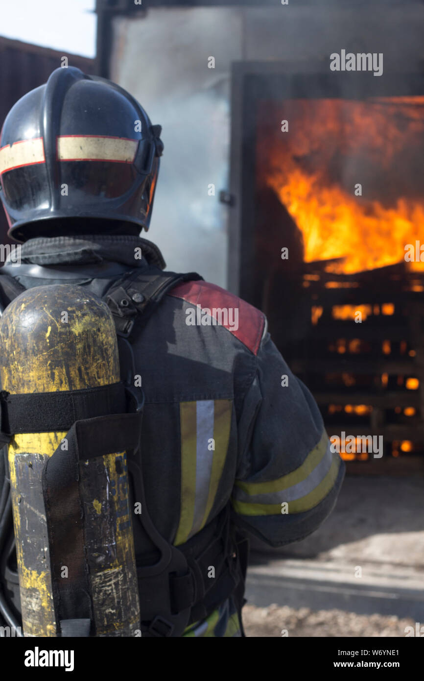 Firefighter putting out fire training station extinguisher backdraft ...