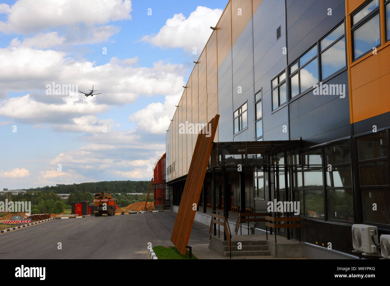 A Large distribution warehouse with gates for loading goods. Staff ...