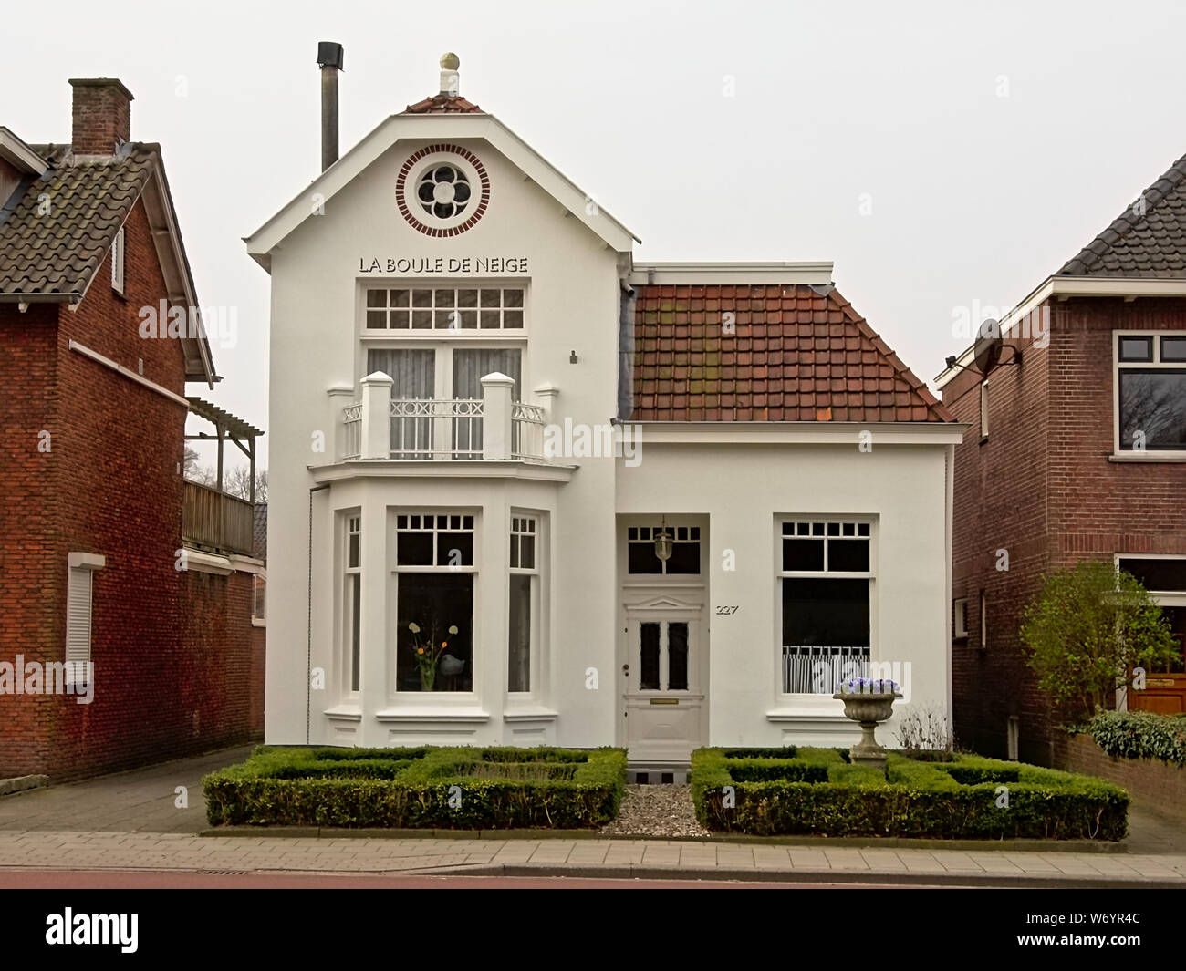Typical neat suburban dutch brick house with front garden. Enschede ...
