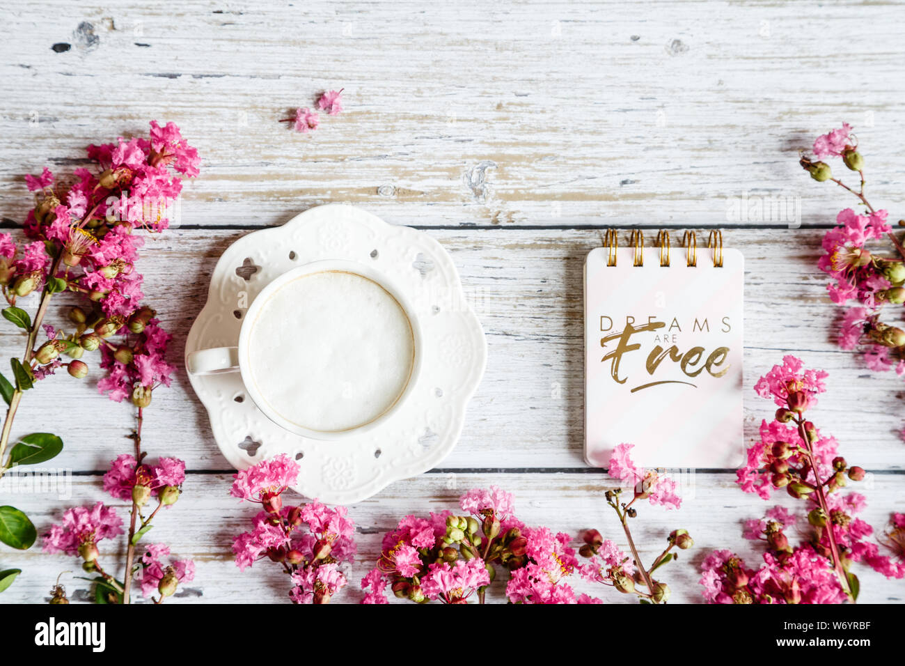 Morning coffee mug for breakfast, notebook, pen, pink flowers on white ...