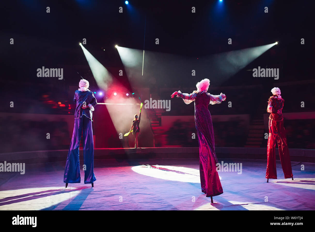 The performance of stilt-walkers in the circus Stock Photo - Alamy