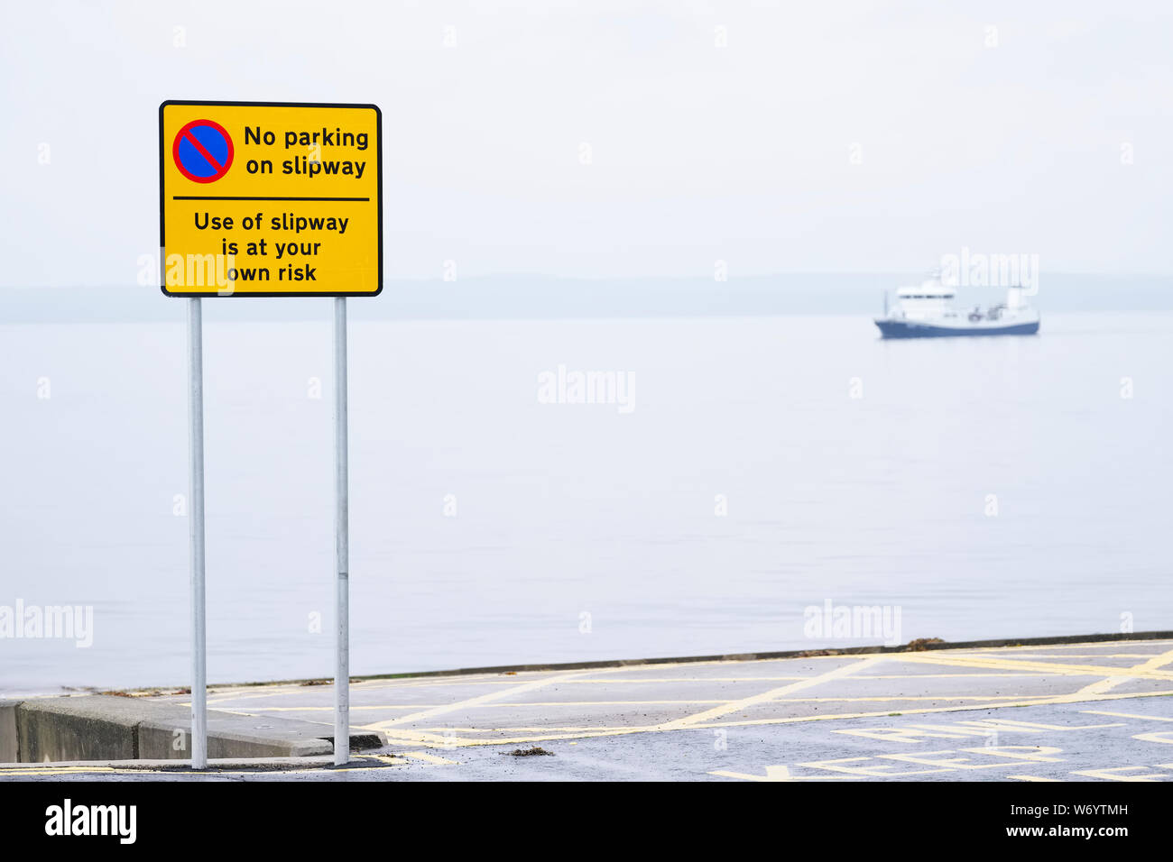 No parking on boat slipway into sea sign Stock Photo - Alamy