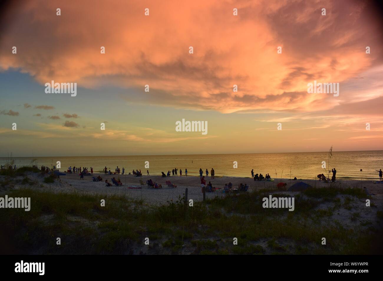 VANILLA TIDES: A beautiful sunset descends upon a crowded beach in ...