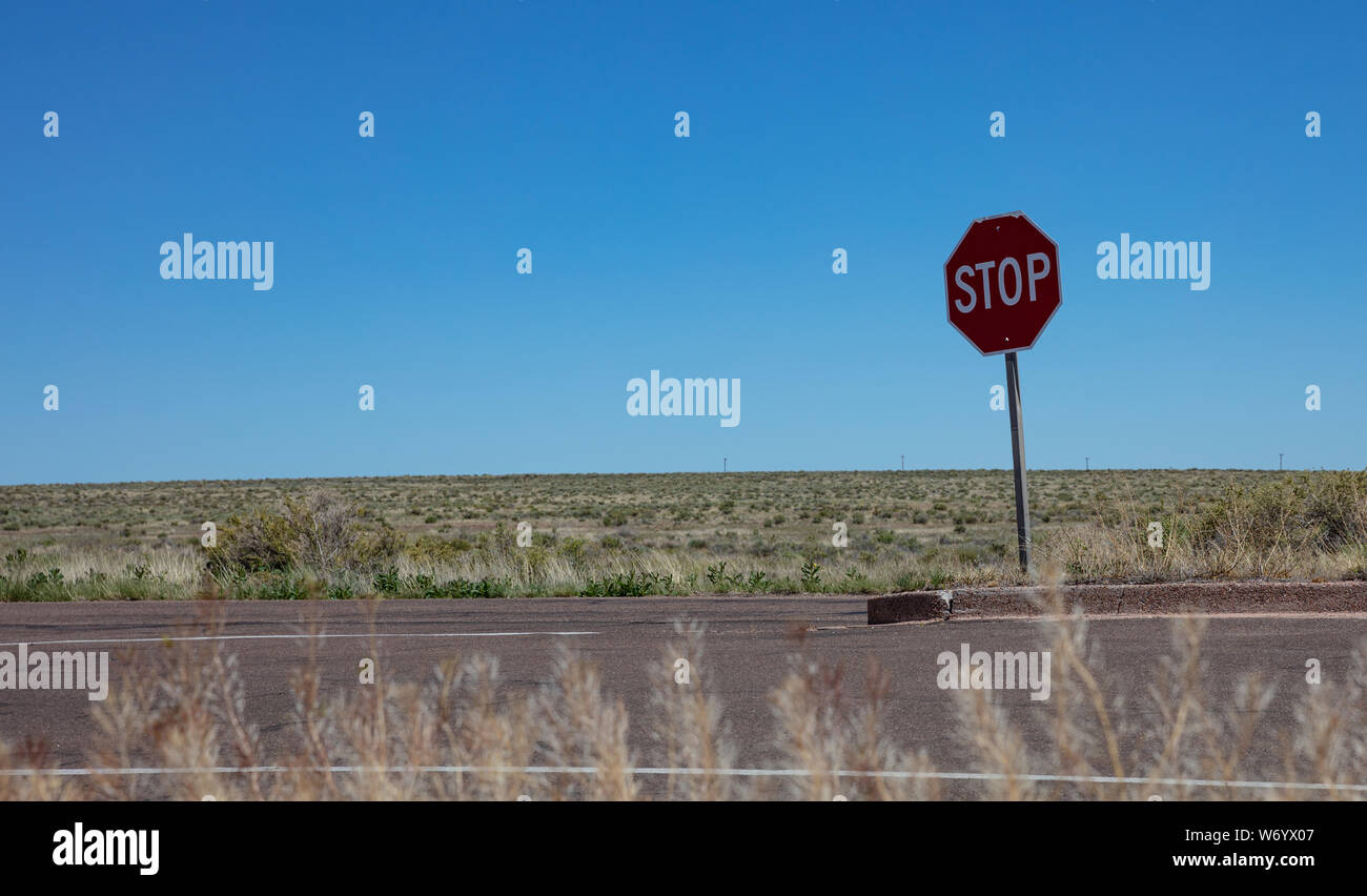 Stop road sign, desert landscape. Sunny spring day in western USA ...
