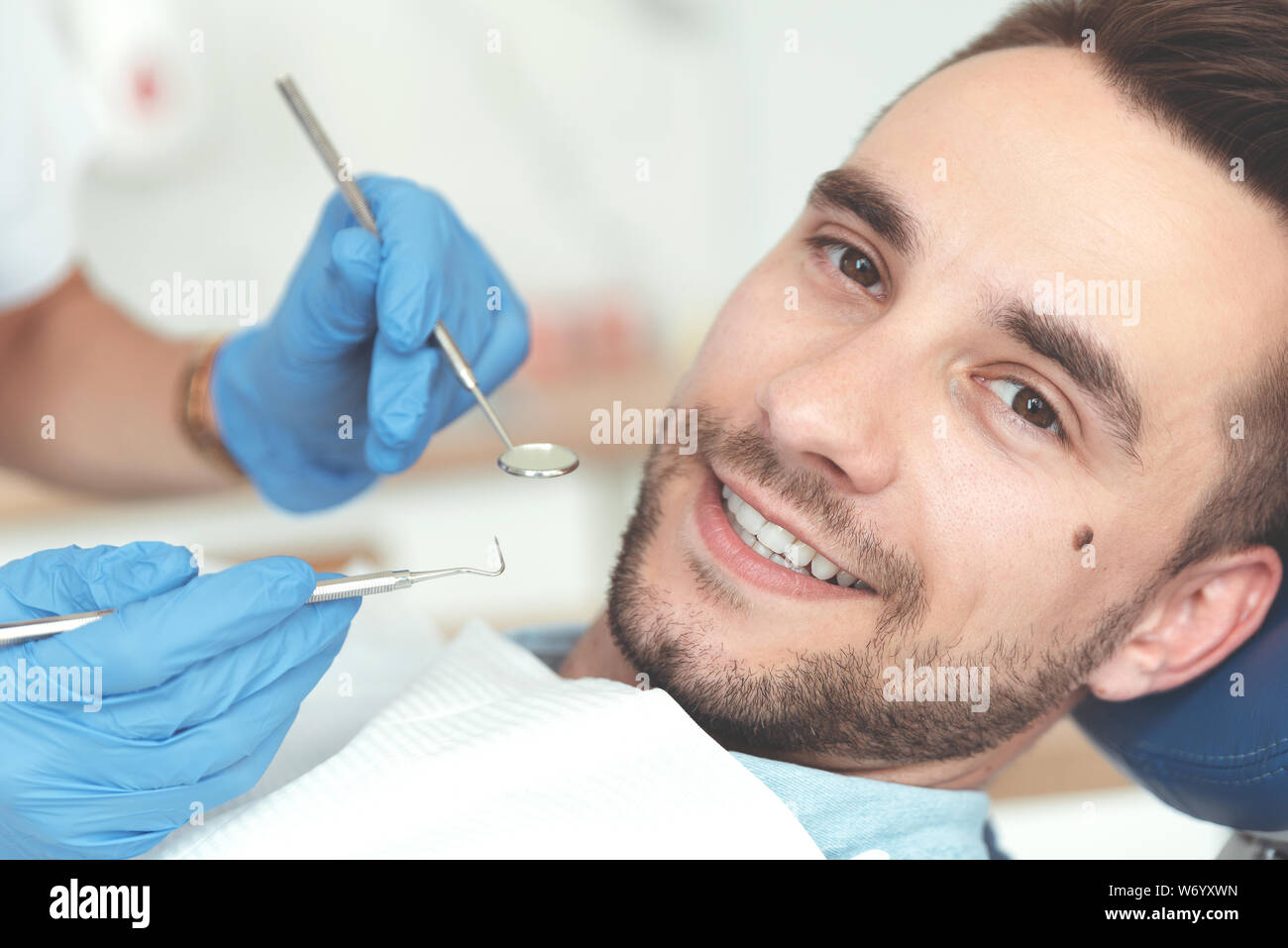 Young man at the dentist. Dental care, treatment of teeth, taking care ...